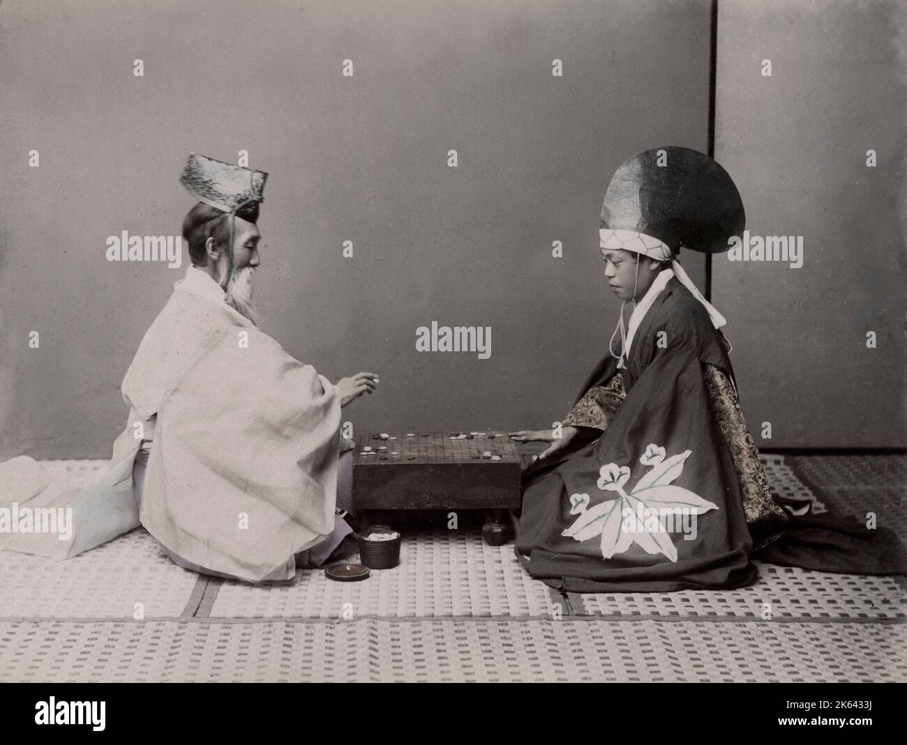 Shinto priests (actors) playing the board game Go (chequers draughts ...