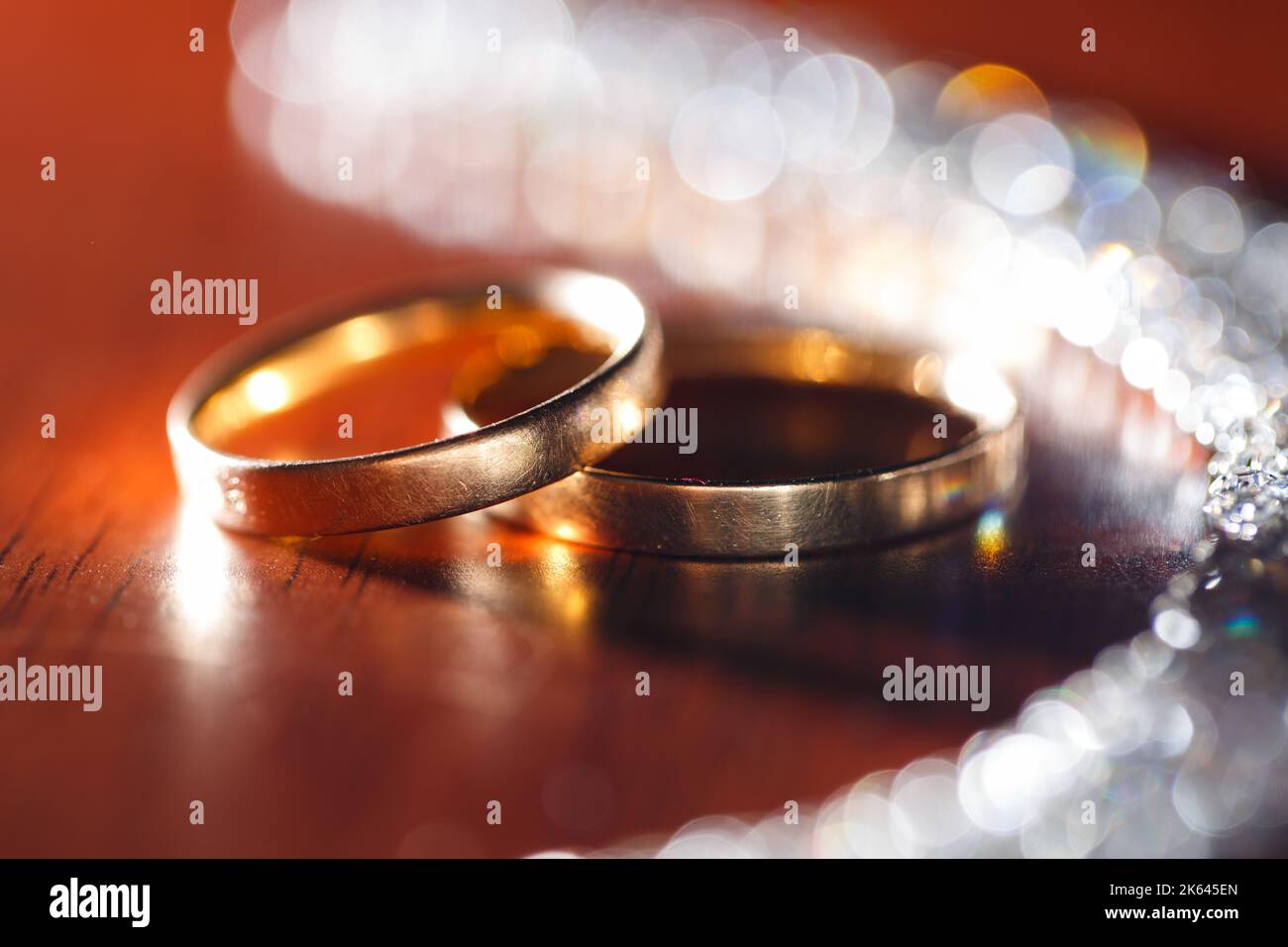 Golden wedding rings for newlyweds Stock Photo - Alamy
