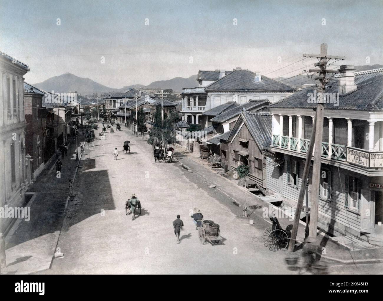 Traditional street scene with rickshaws and carts, Japan, c.1880's ...