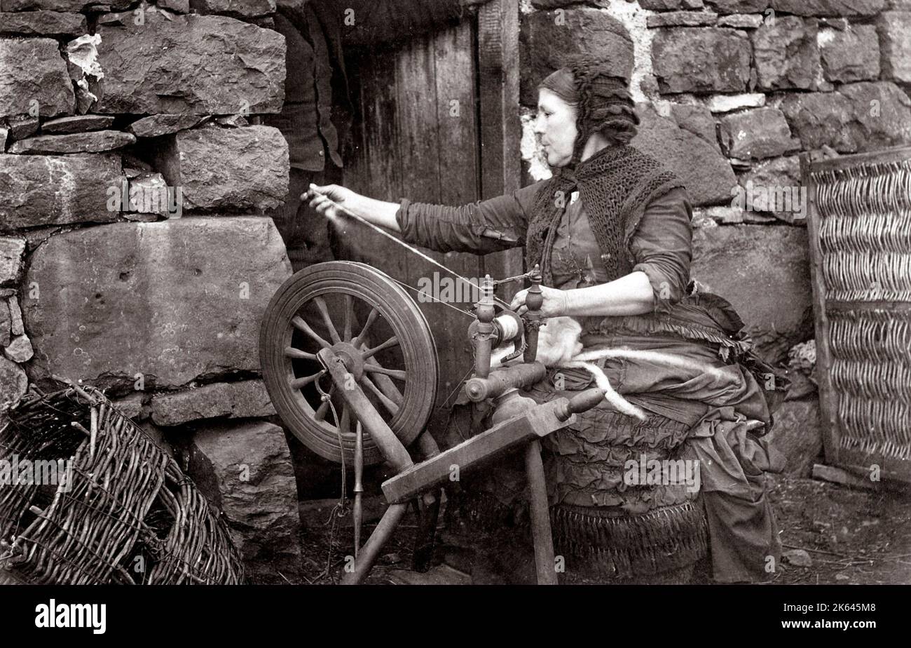 Old woman spinning wheel hi-res stock photography and images - Alamy