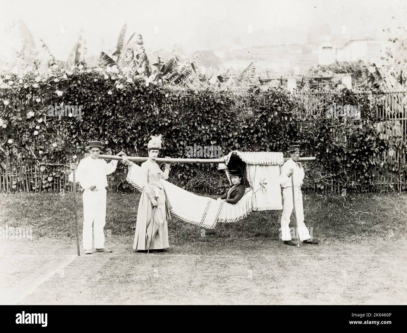 Vintage 19th century photograph - woman being carrried in a hammock ...
