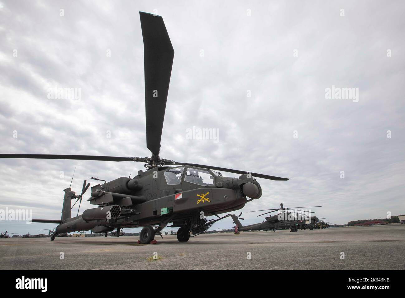 An AH-64E Apache sits on the flightline at Hunter Army Airfield ...