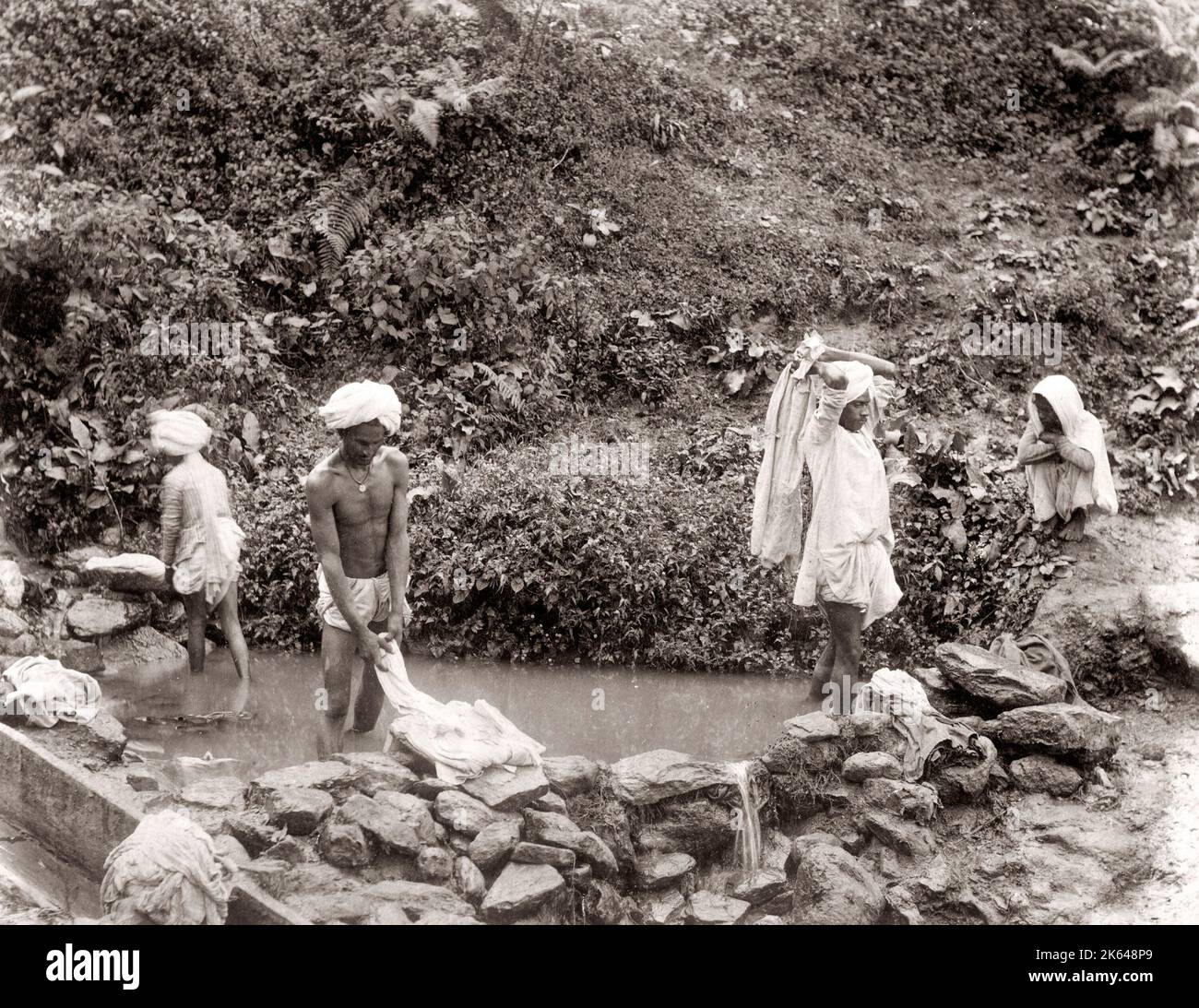 Washing clothes in a river, India, c.1880's Stock Photo - Alamy