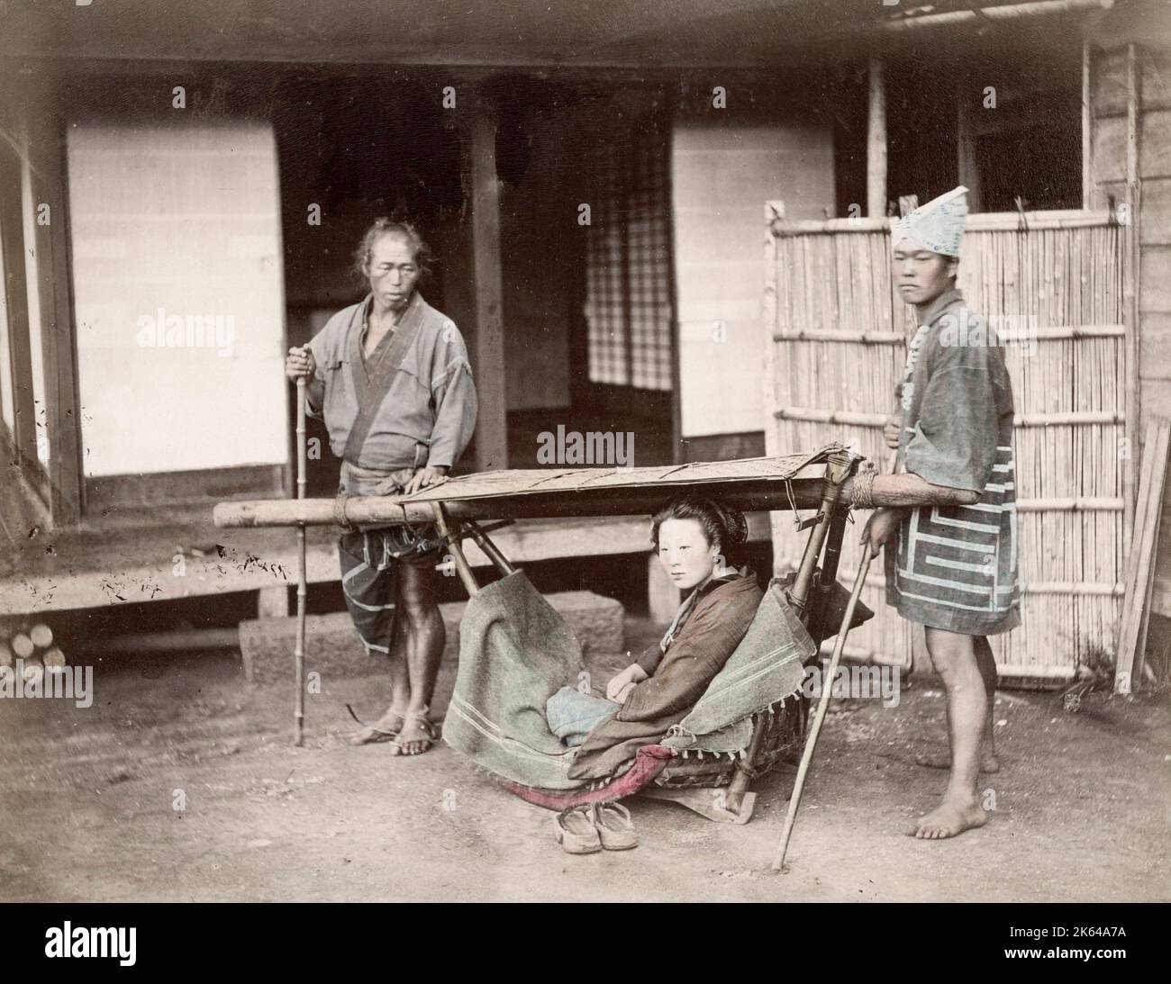 Vintage late 19th century photograph: Woman in a kago, carrying chair ...