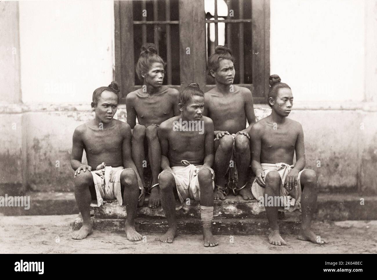 Vintage 19th century photograph: group of prsioners, Siam, Thailand. Captioned as 'Colonel ...