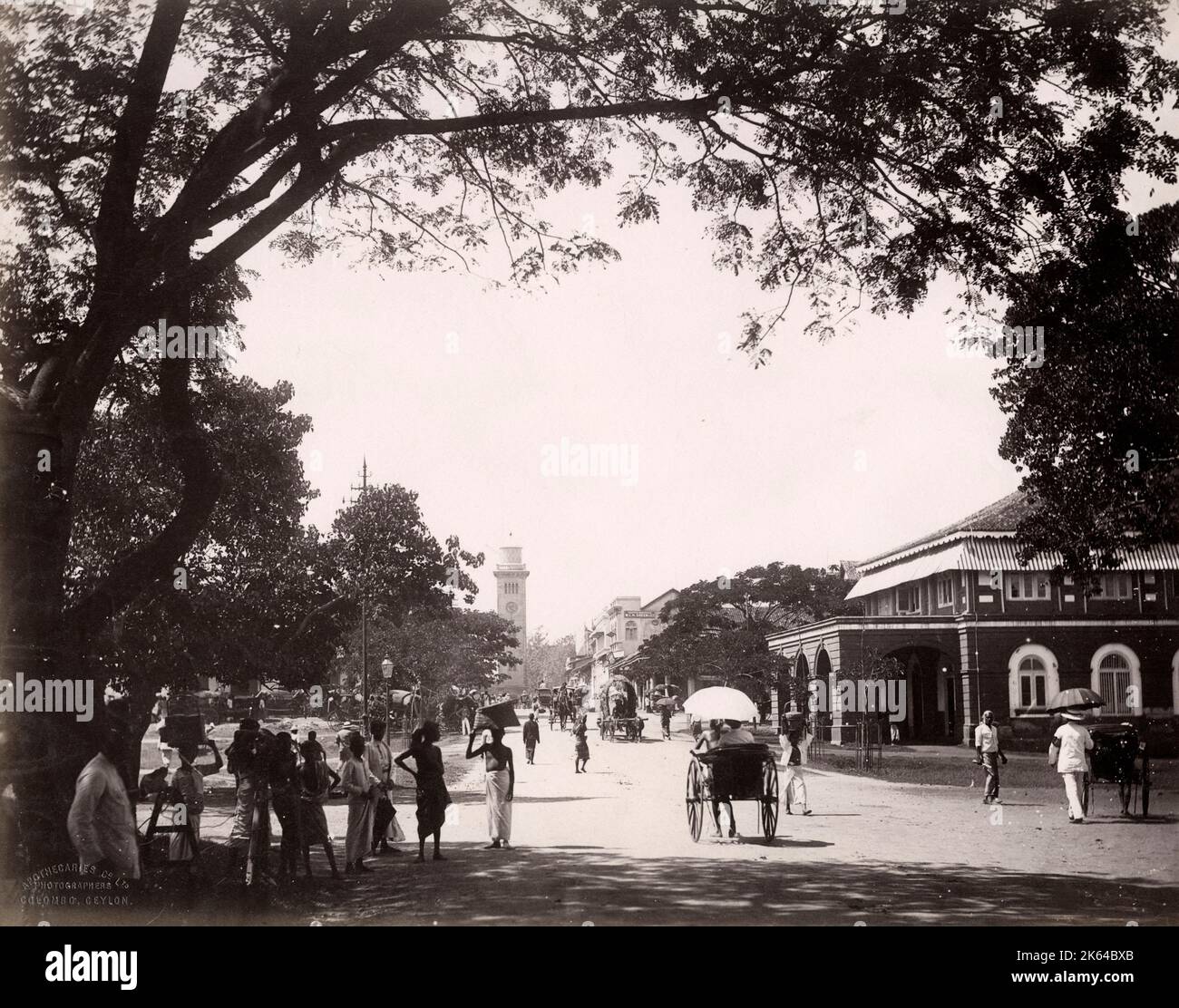 Vintage late 19th century photograph: Street scene, clock tower ...