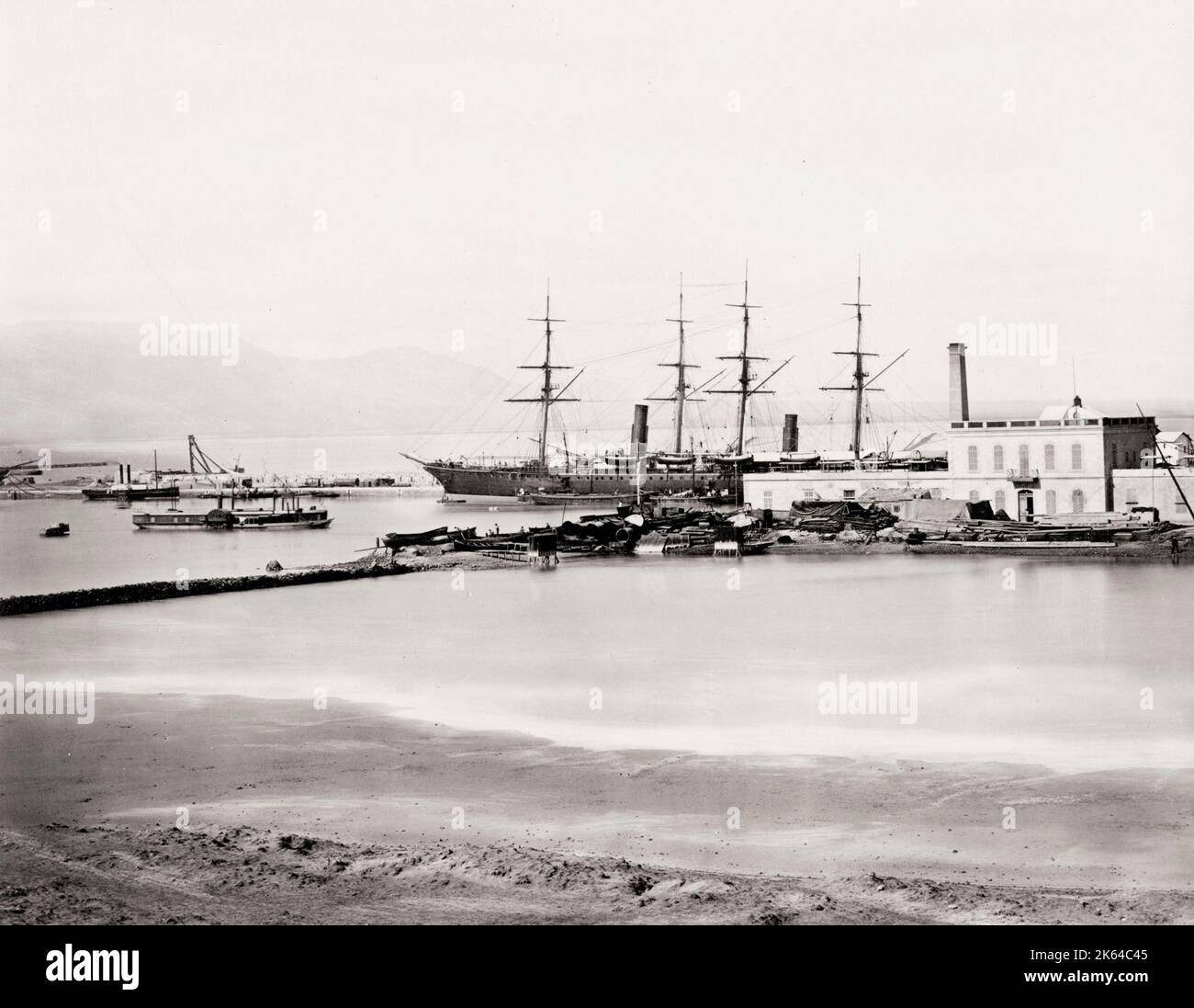 Vintage 19th century photograph: ship tied at dock, wharf, Suez Canal ...