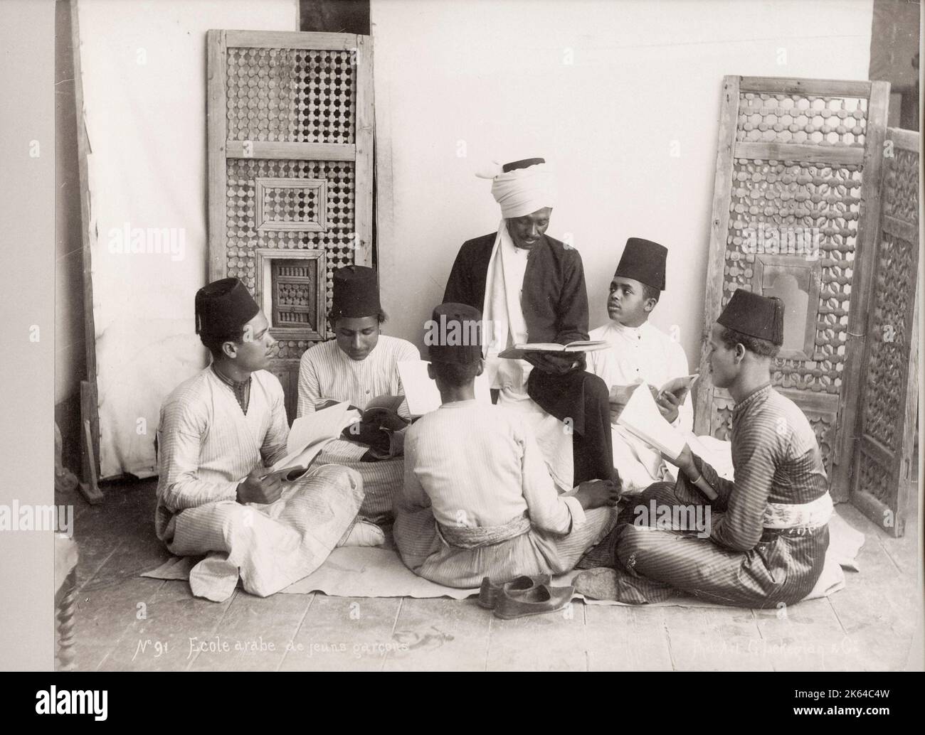 Vintage 19th century photograph: young muslim boys being taught by a ...
