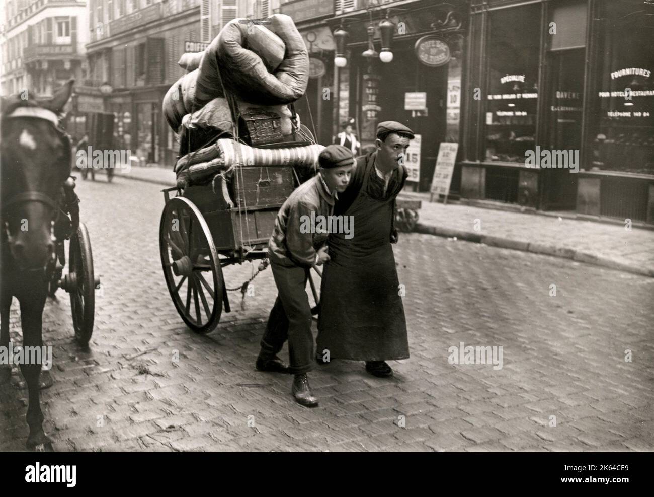 Moving home - street cart with furniture Paris France c.1920s Stock ...