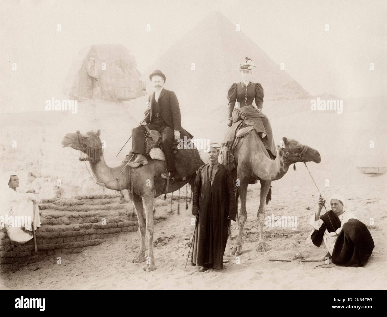 Vintage 19th century photograph - tourists on camels with guides ...
