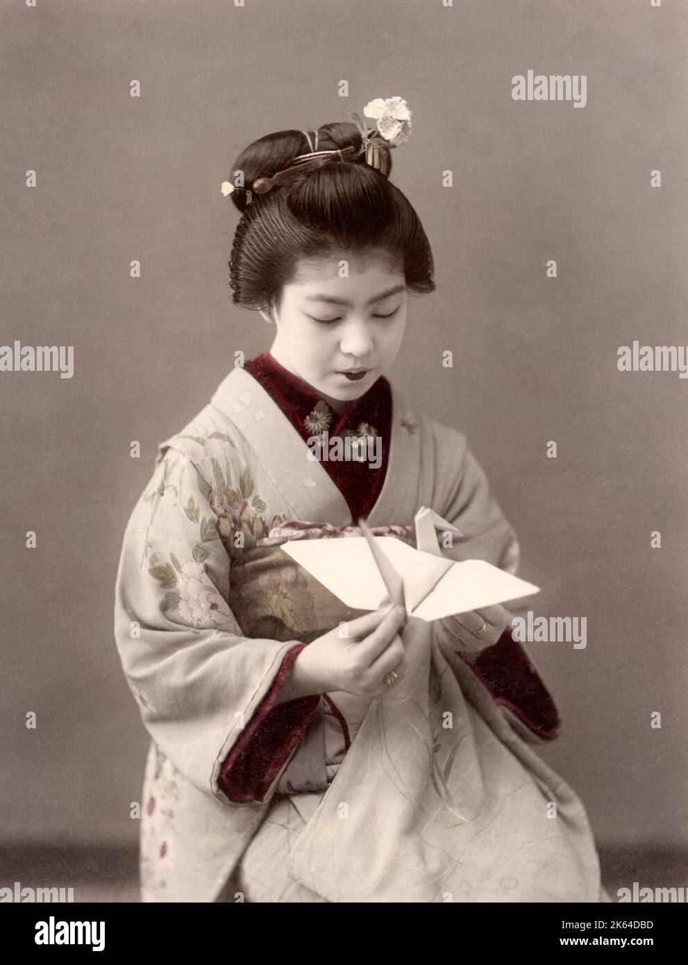 c. 1880s Japan - geisha with a paper bird Stock Photo - Alamy