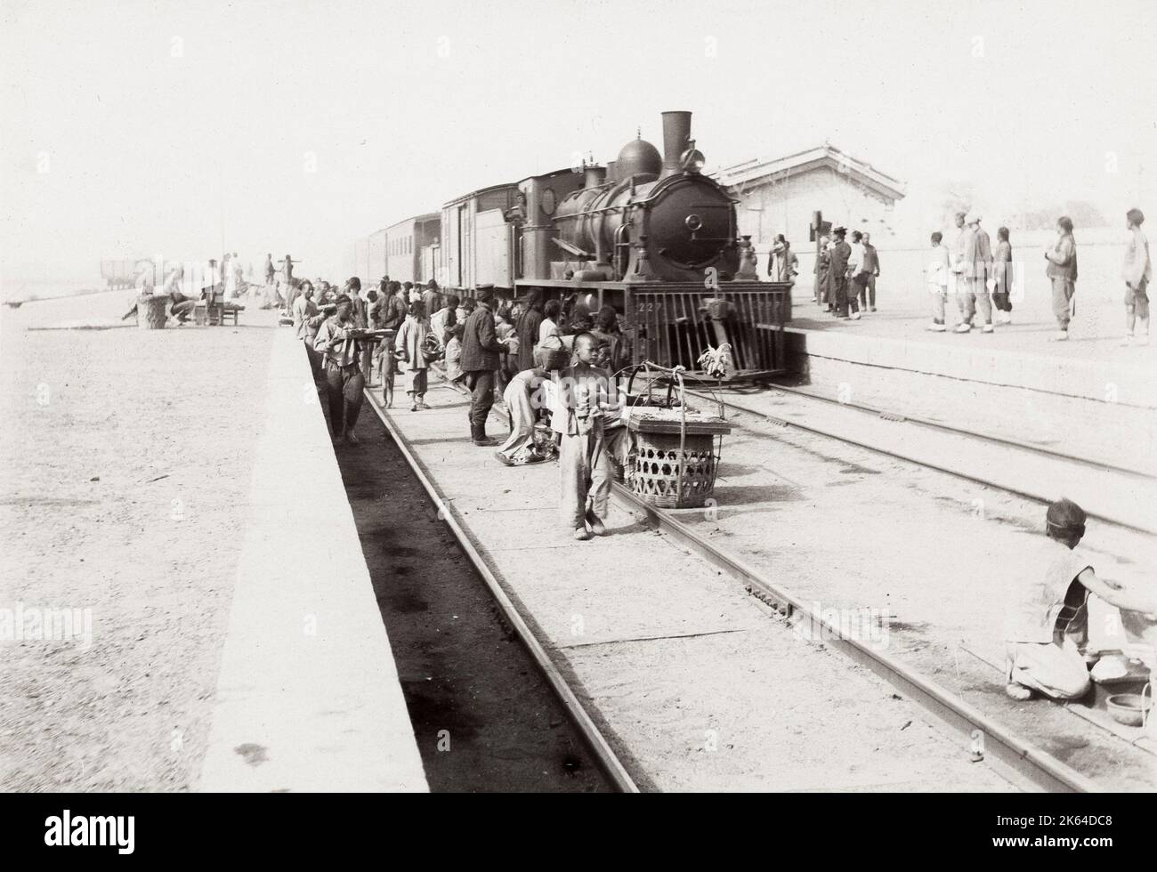 Early 20th century photograph: Steam train in a station, China, c.1910 ...