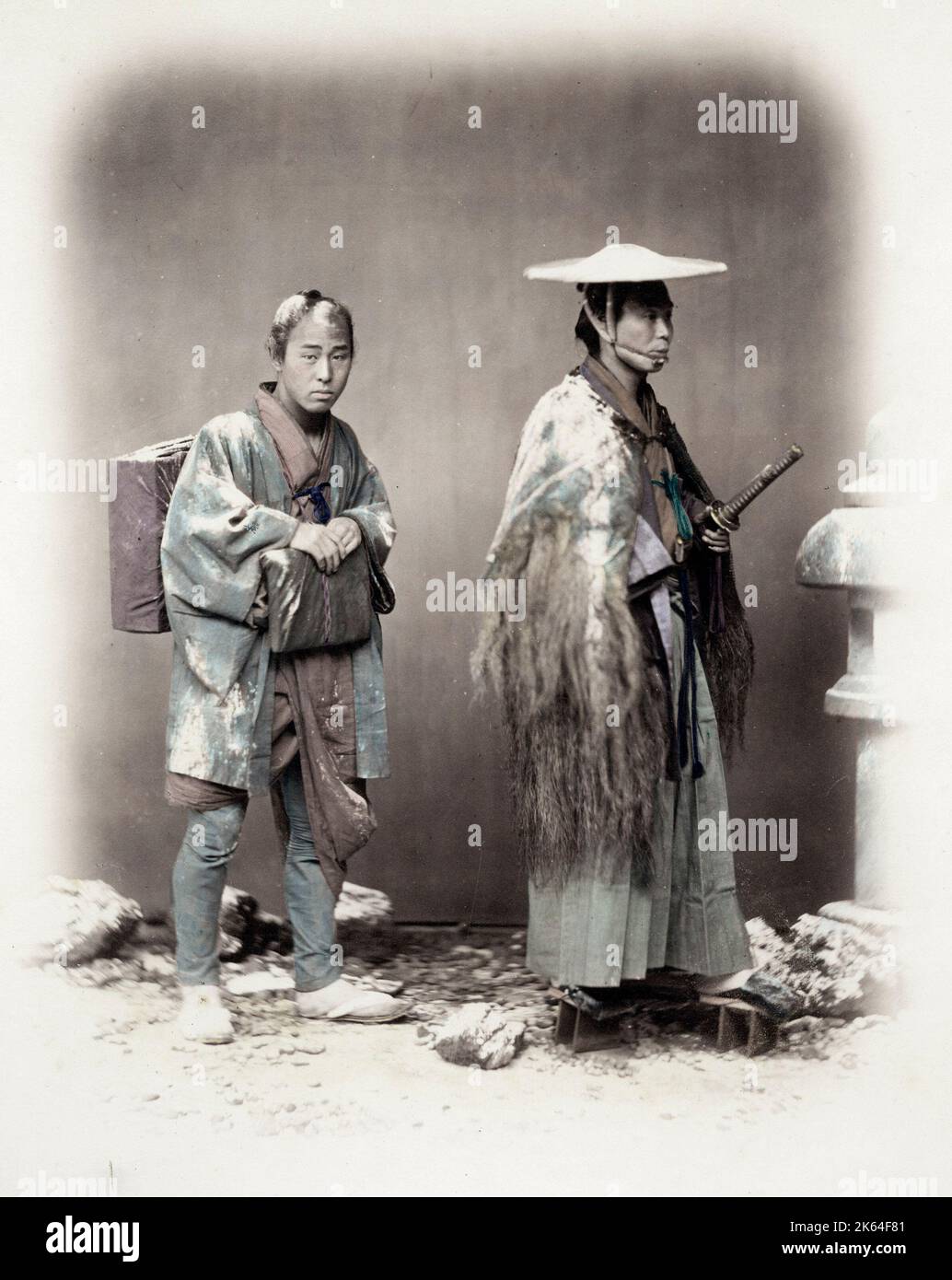1860's Japan - portrait of a samurai and his servant travelling in snow ...