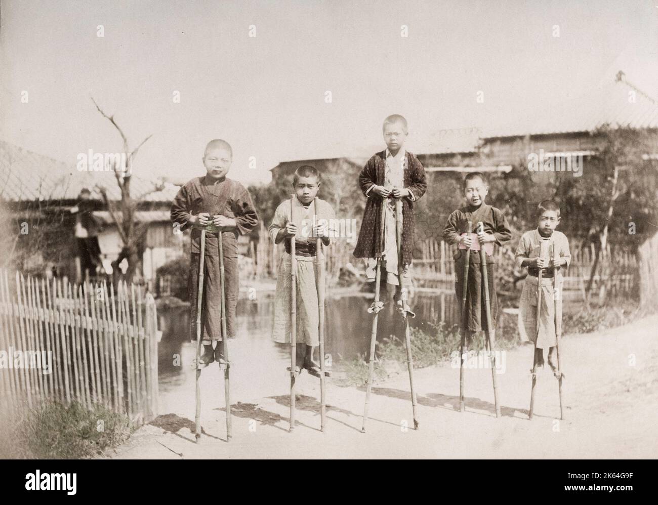 Vintage 19th century photograph: Boys on stilts - described as bamboo ...