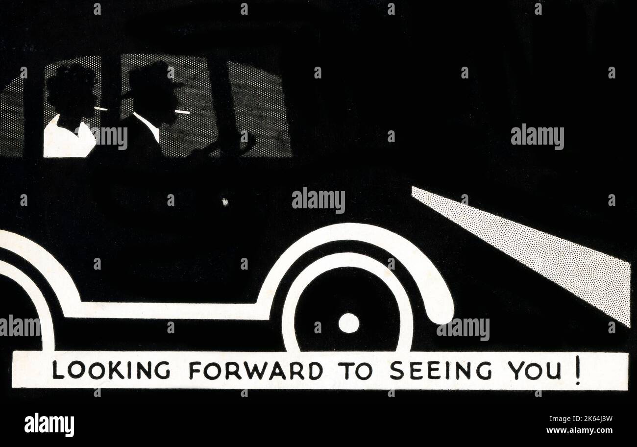 WW2 - Black-out - Couple driving, with only their dipped headlight ...