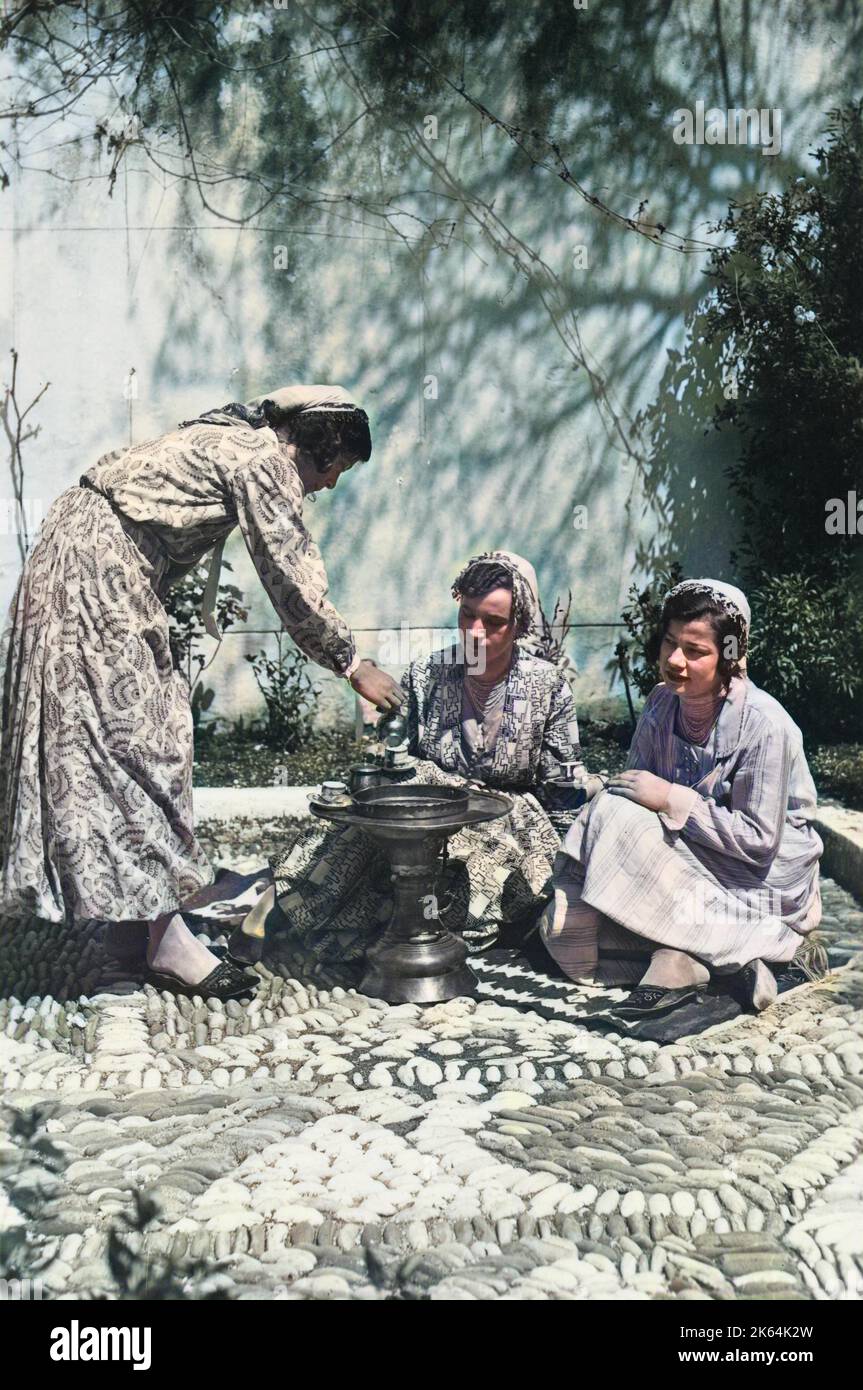 Women taking coffee sat on the cobbles in Mostar, Bosnia & Herzegovina ...