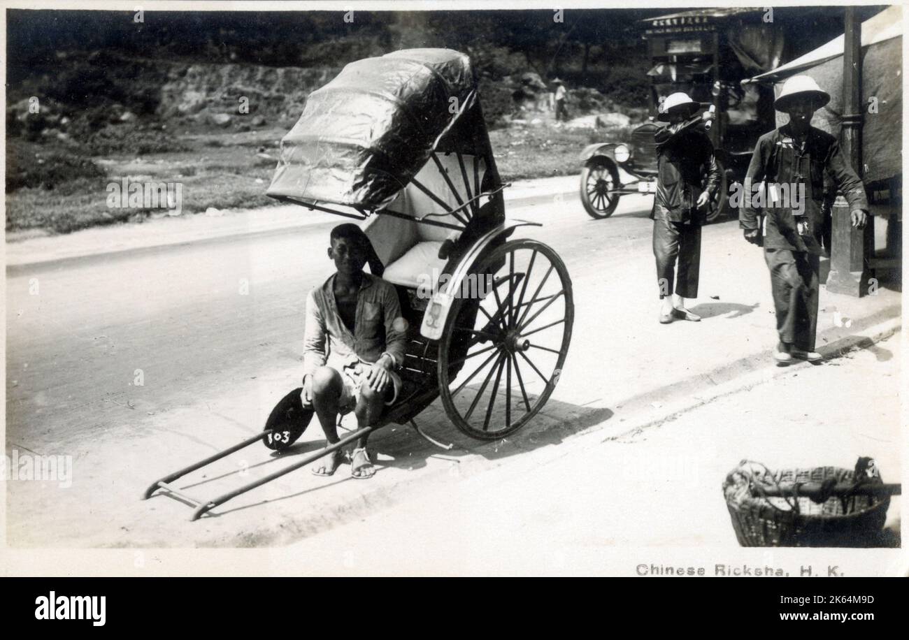 Chinese Rickshaw Boy taking a rest - Hong Kong Stock Photo - Alamy
