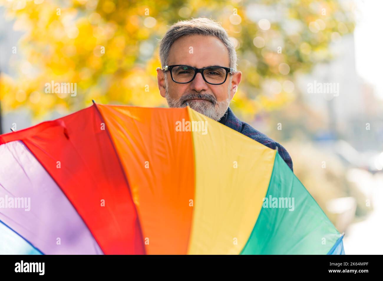 Proud elderly caucasian man with gray facial hair looking at camera ...