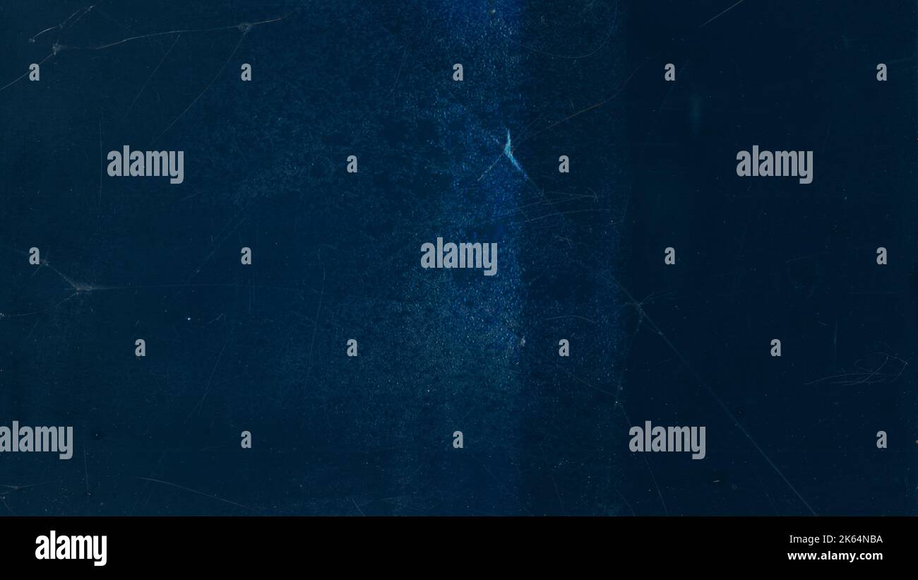 scratched filmstrip aged texture flecks glow Stock Photo - Alamy