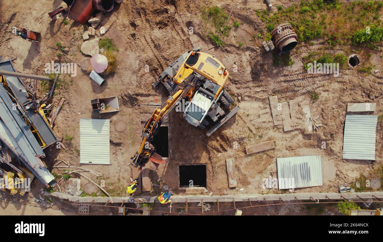 Demolition construction working site. An excavator performing lifting ...