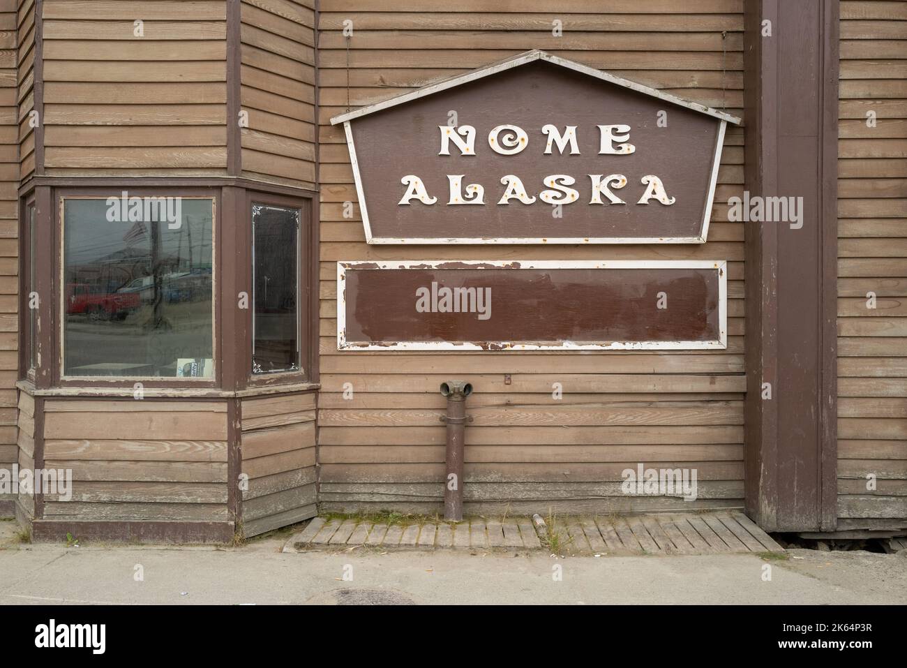 A signage on a wooden building in Nome, Alaska Stock Photo - Alamy