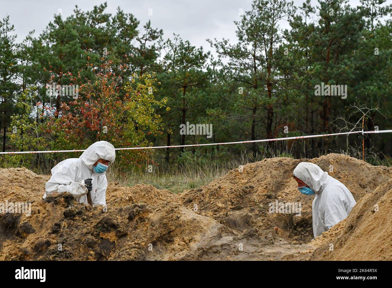 Lyman, Donetsk, Ukraine. 11th Oct, 2022. Members of a forensic team at ...