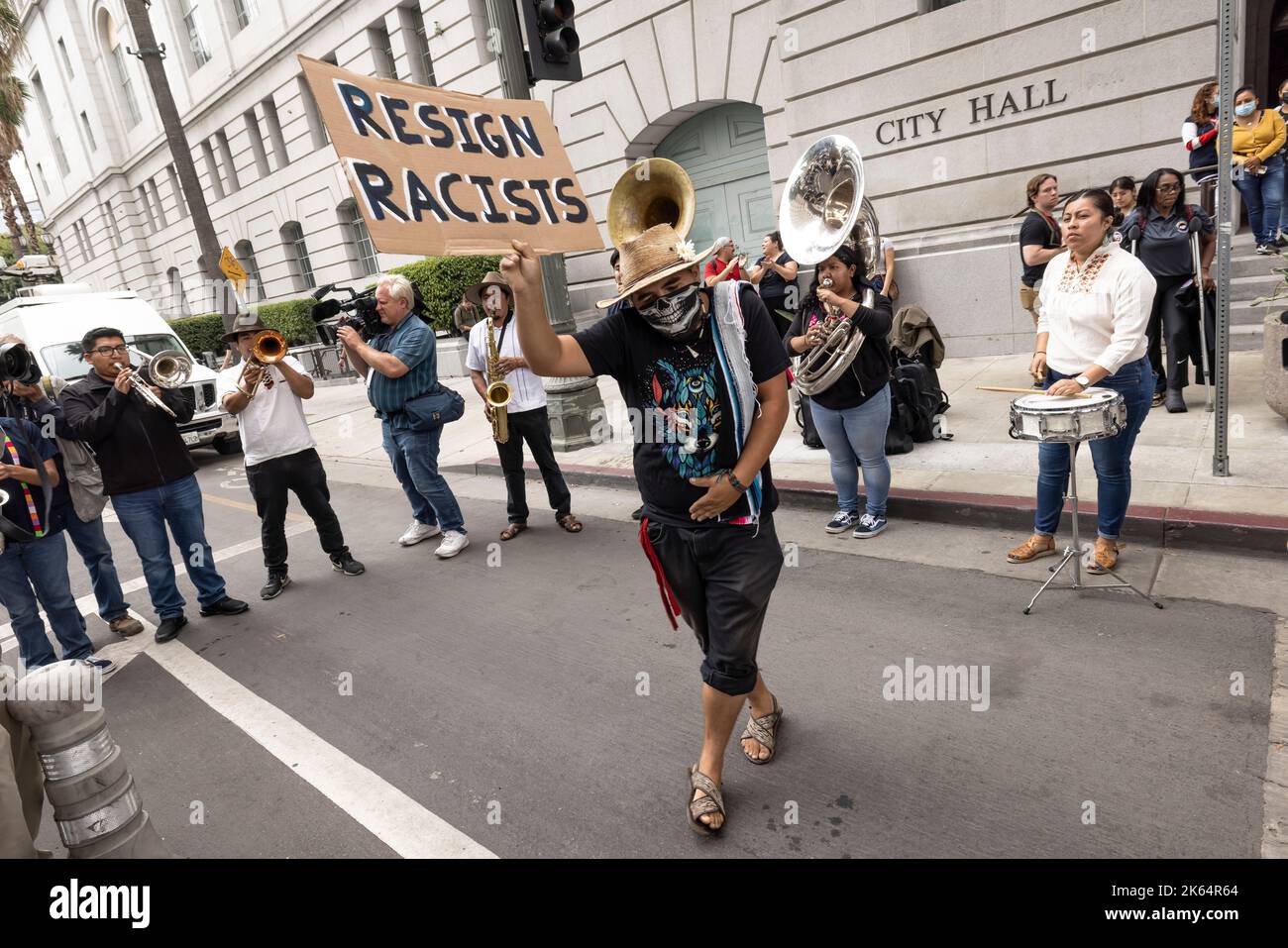 A local Oaxcan musical group and dancer protest outside LA City Hall ...