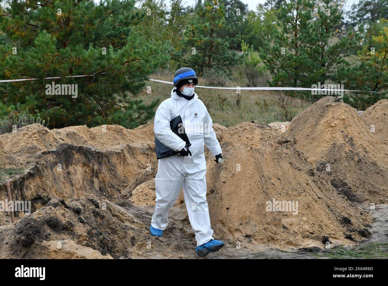 Lyman, Donetsk, Ukraine. 11th Oct, 2022. Member of a forensic team at ...