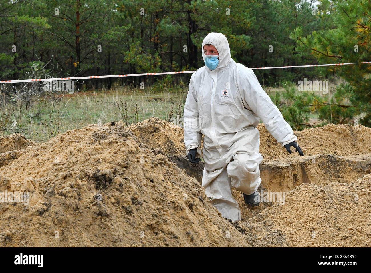 Lyman, Donetsk, Ukraine. 11th Oct, 2022. Member of a forensic team at ...