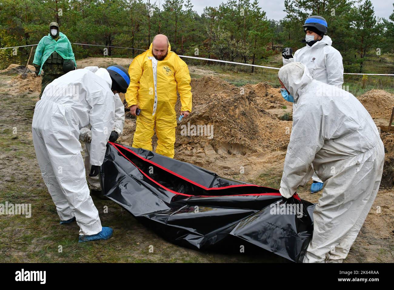 Lyman, Donetsk, Ukraine. 11th Oct, 2022. Members of a forensic team at ...