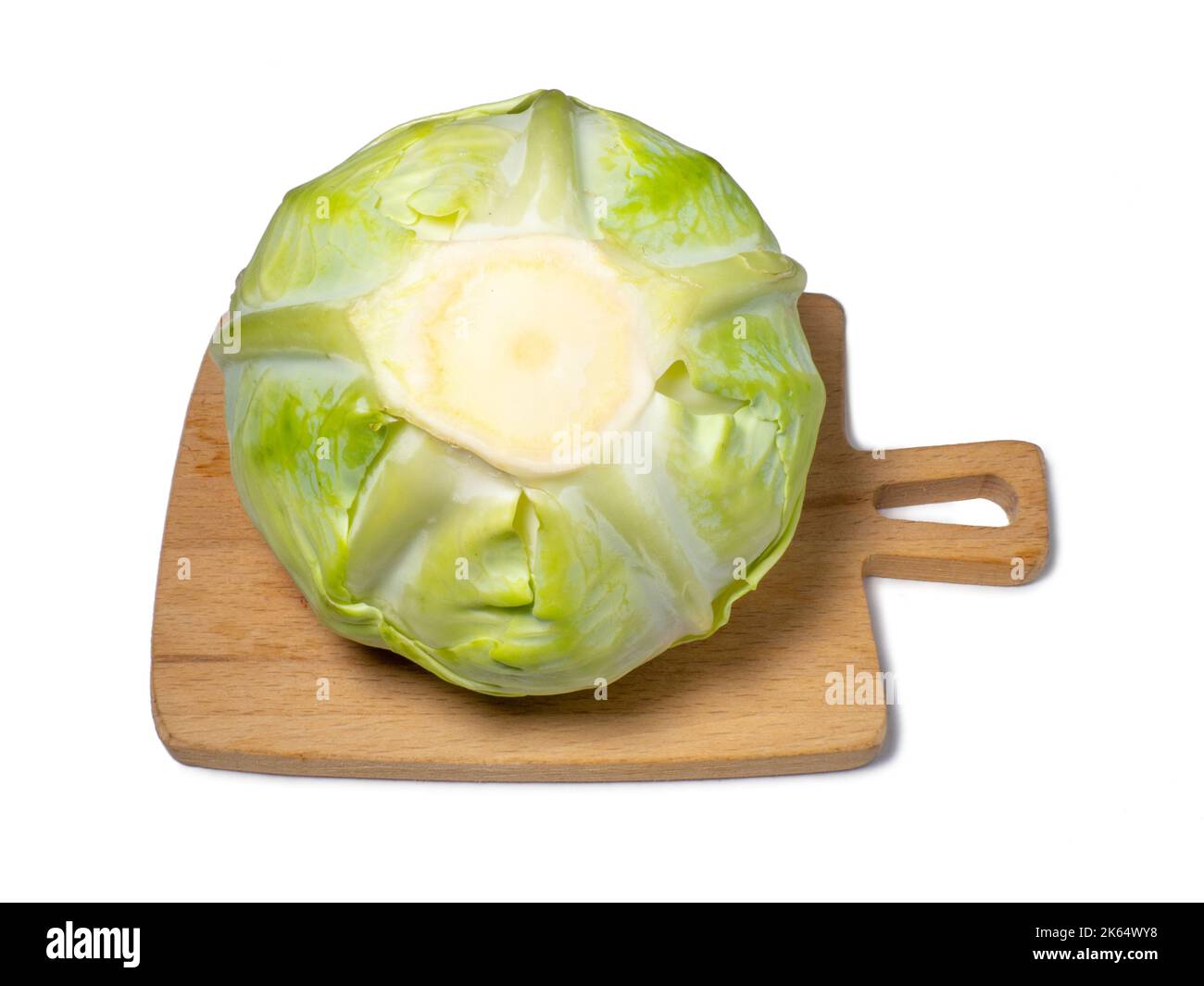 White cabbage on a cutting board on a white background. From the garden ...