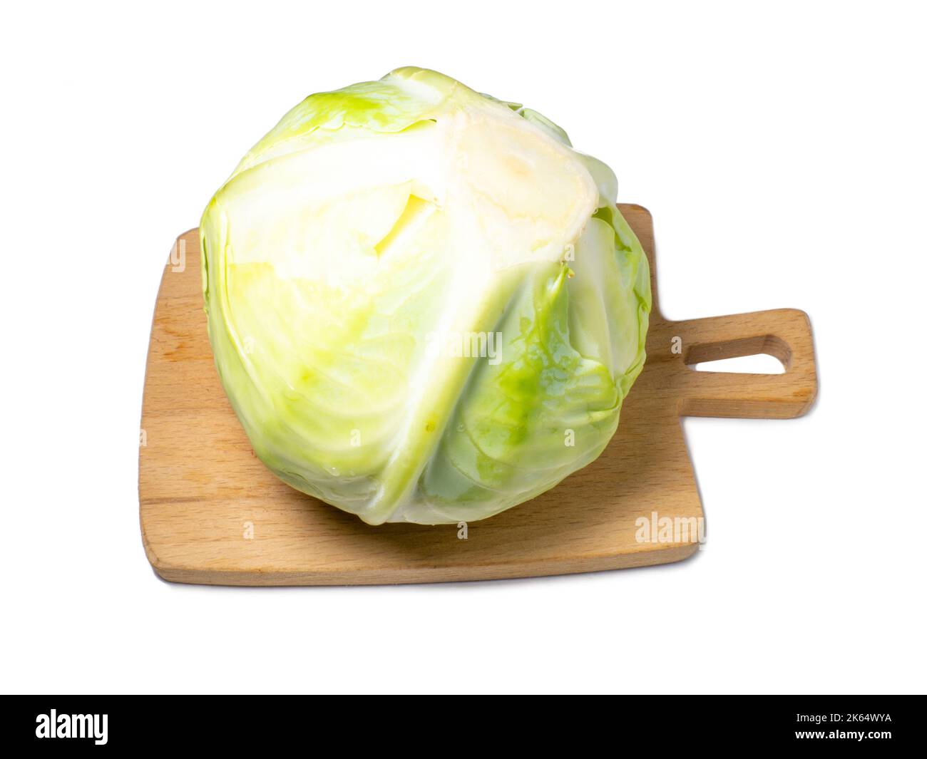 White cabbage on a cutting board on a white background. From the garden ...