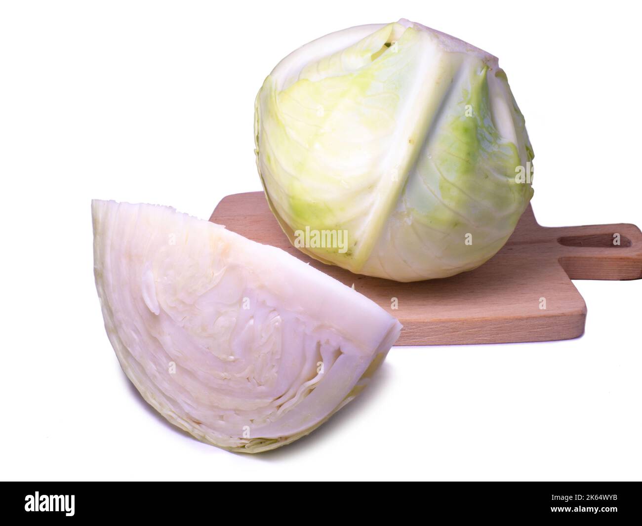 Pieces of white cabbage on a white background. From the garden ...