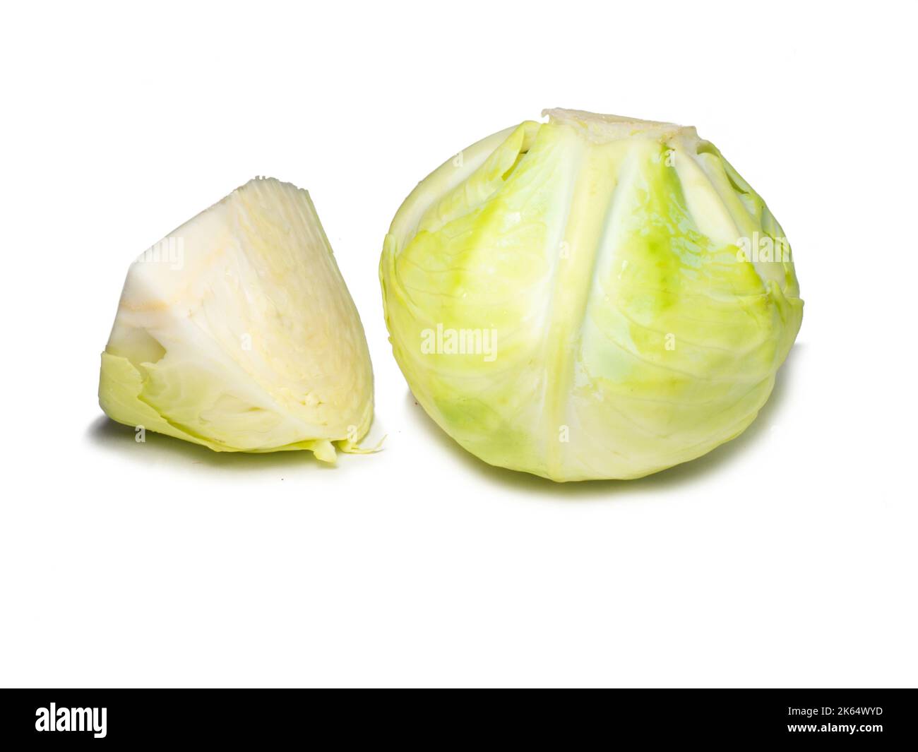 Pieces of white cabbage on a white background. From the garden ...
