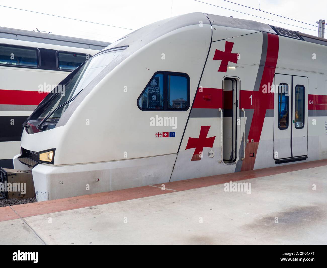 At the pier near the departing train. Train locomotive. Georgian ...
