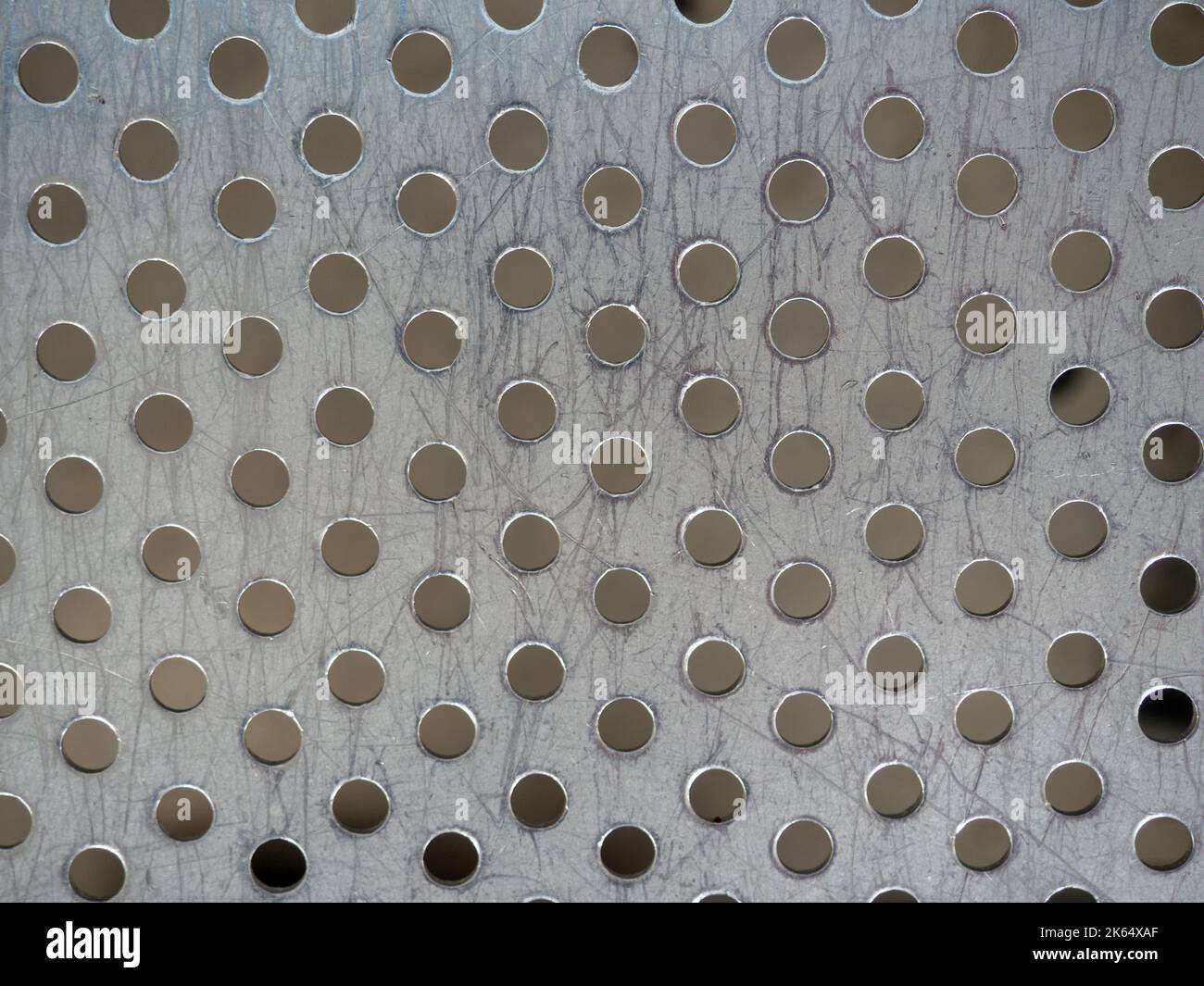 Metal surface in a hole. Leaky iron. Metal background. The surface of ...