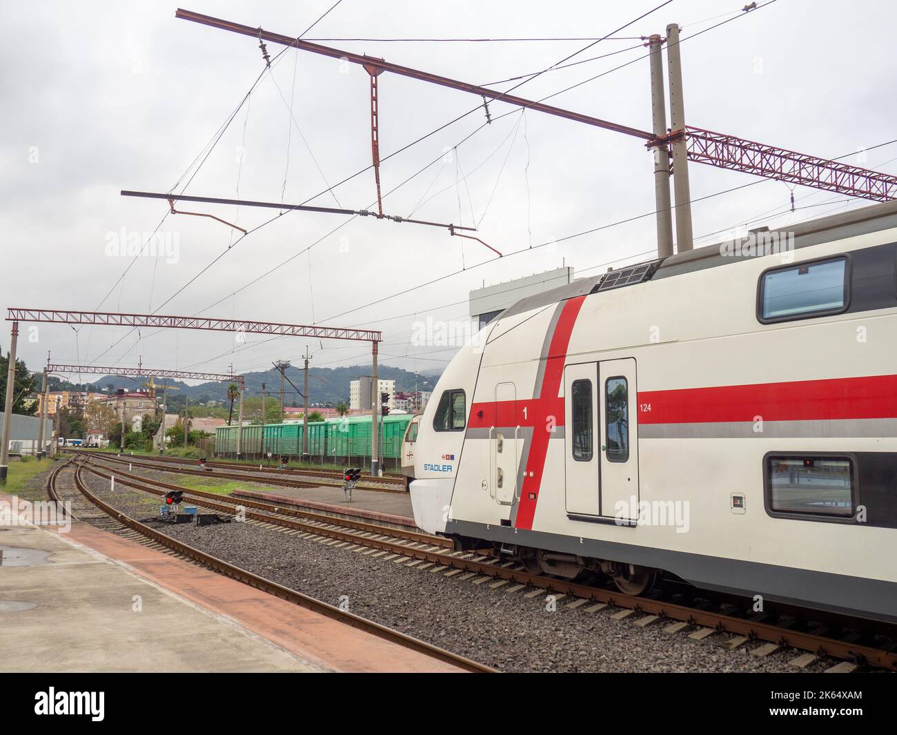 At the pier near the departing train. Train locomotive. Georgian ...