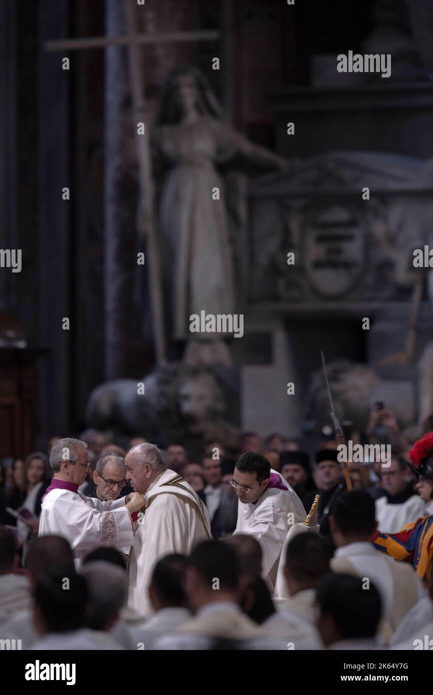 Vatican City, Vatican. 11th Oct, 2022. Pope Francis is helped to wear ...