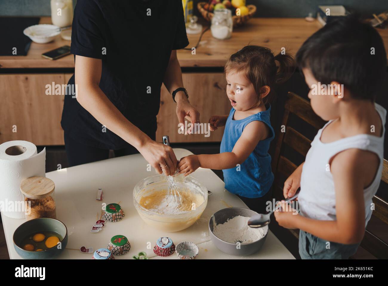 Happy family in the kitchen preparing the dough, baking cookies. Family ...