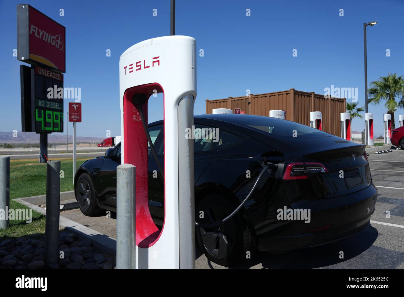 A Tesla Supercharger station, Tuesday, Sept. 27, 2022, with gasoline ...
