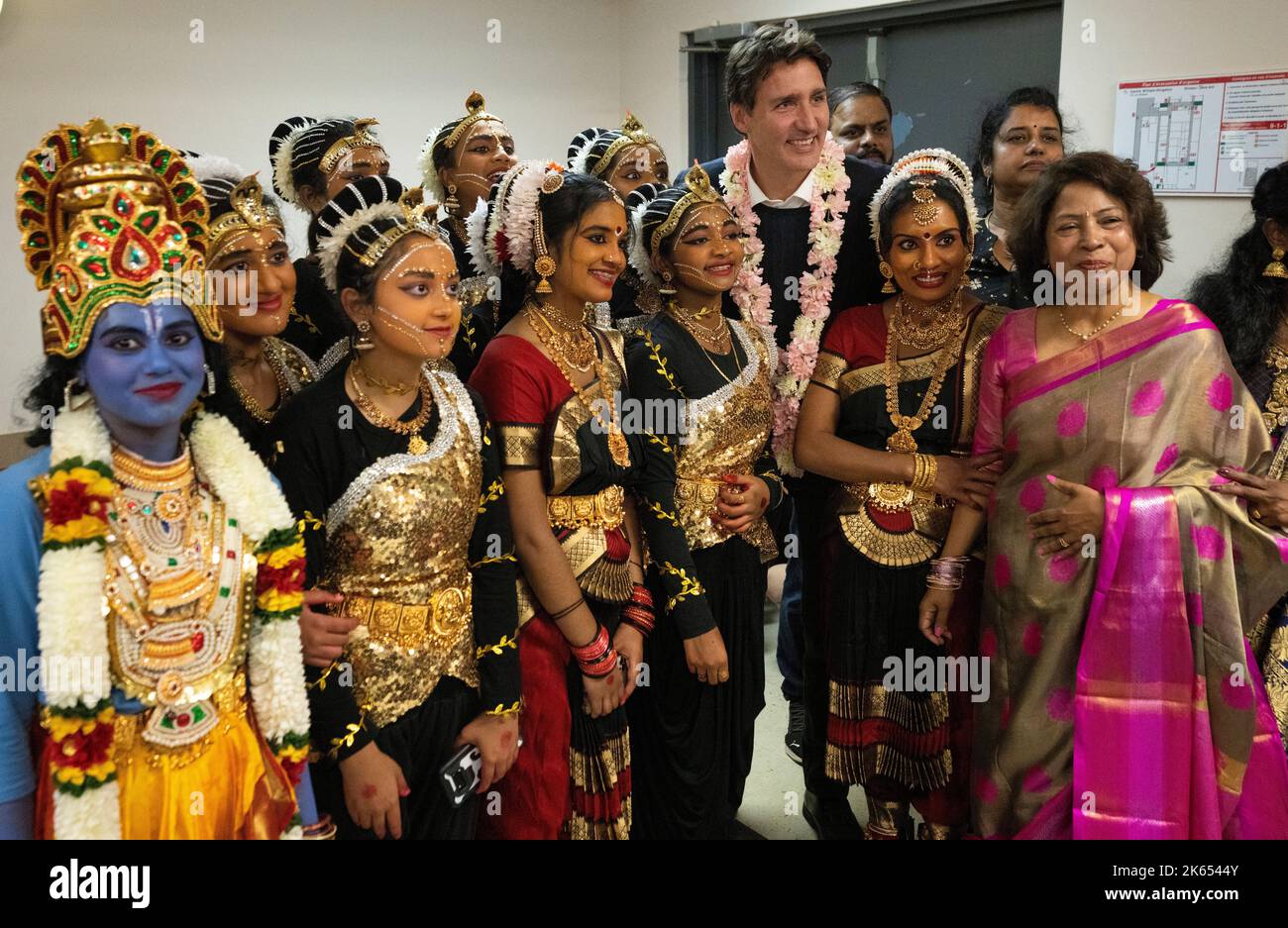 Prime Minister Justin Trudeau poses for a photograph with a group of ...