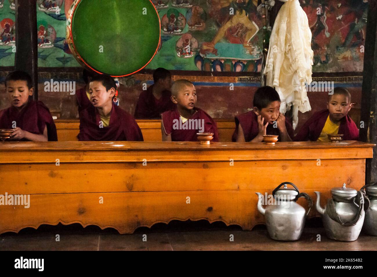 Novice monks of the Gelugpa or Yellow Hat order meet for prayer at ...