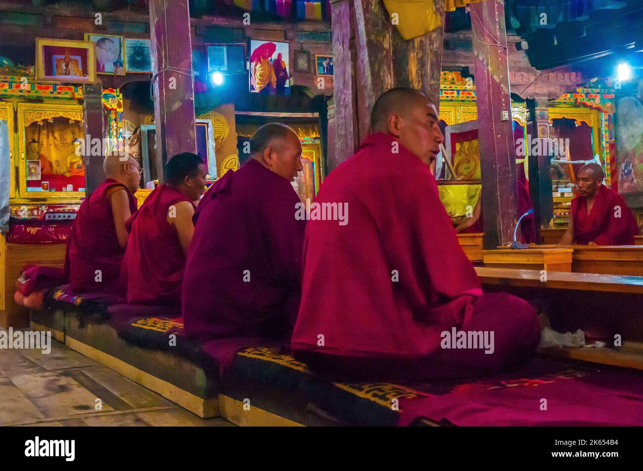Buddhist monks of the Gelugpa or Yellow Hat order meet for prayer at ...