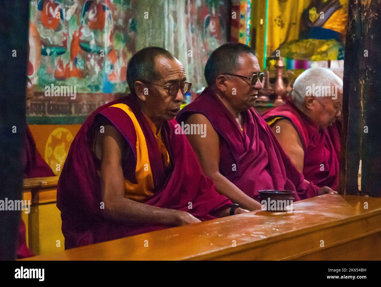 Buddhist monks of the Gelugpa or Yellow Hat order meet for prayer at ...