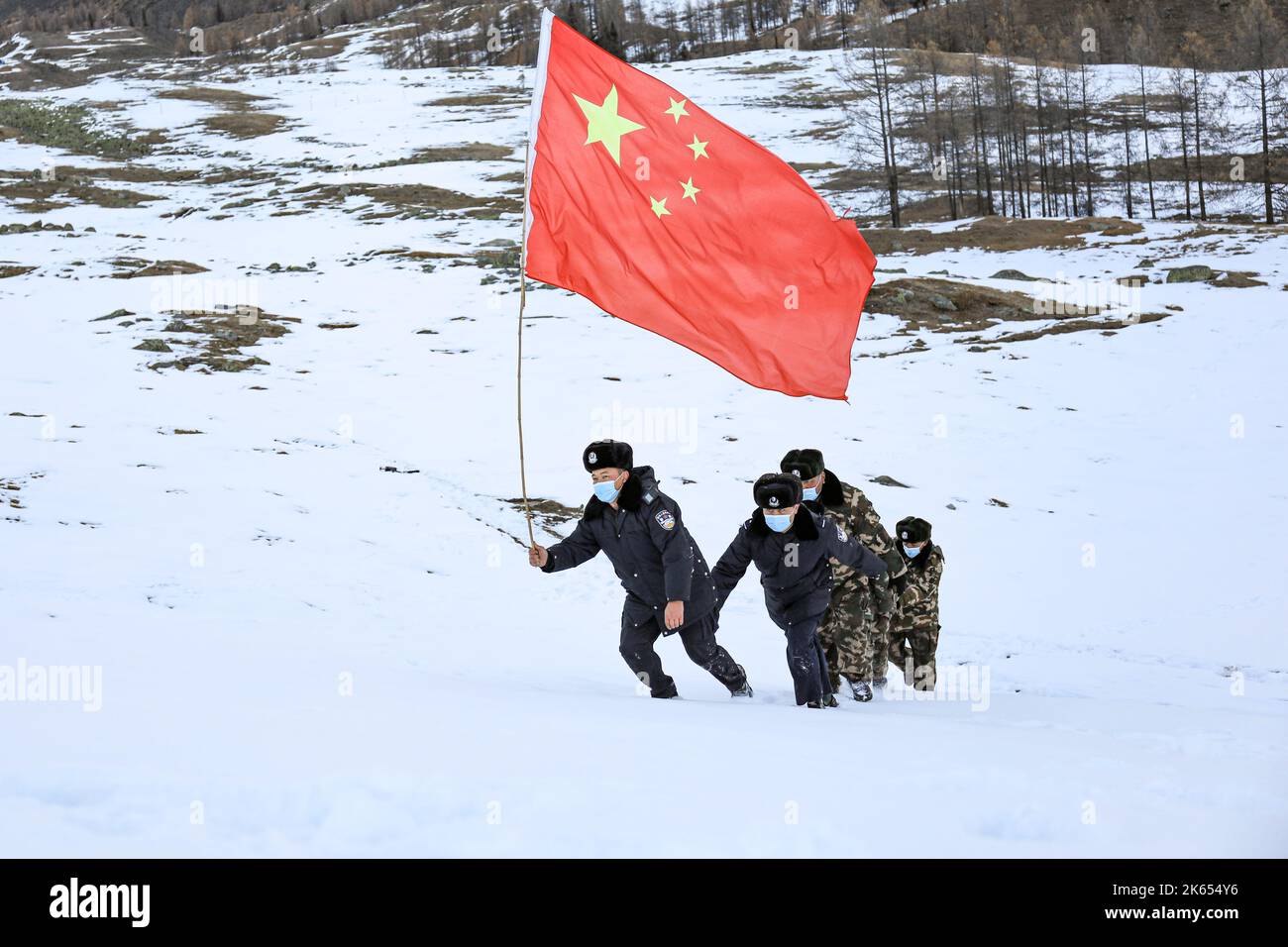 ALTAY, CHINA - OCTOBER 11, 2022 - Chinese border police patrol the snow ...