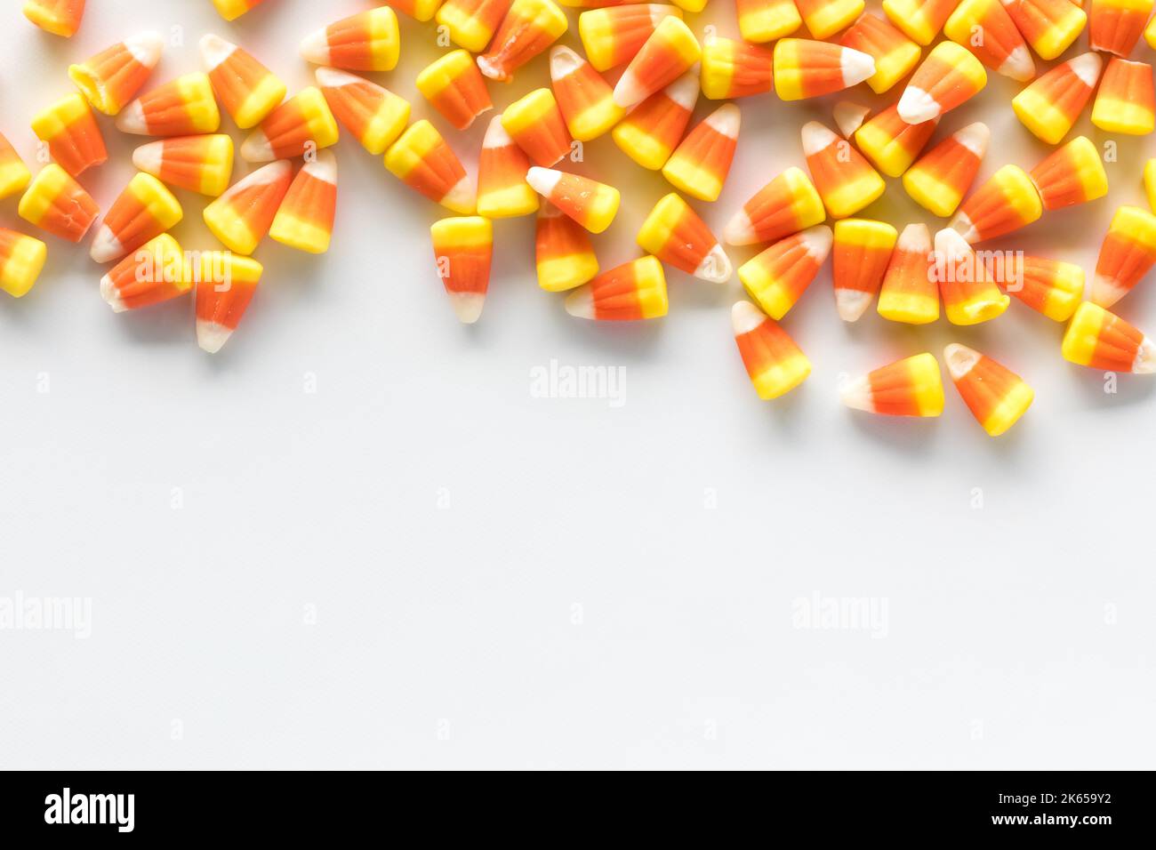Candy corn forming a border at the top of the frame with copy space ...