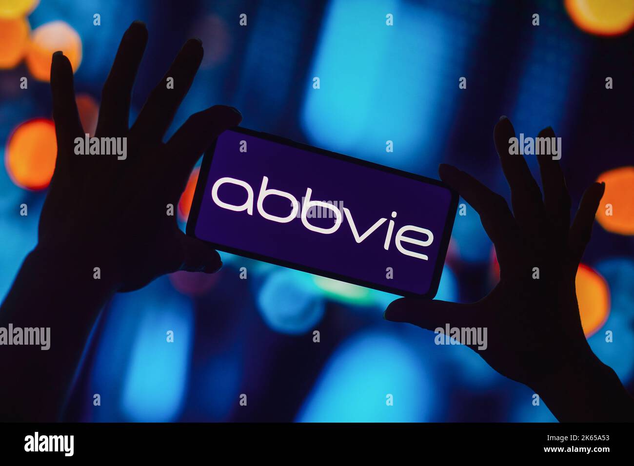In this photo illustration, the AbbVie logo is displayed on a ...