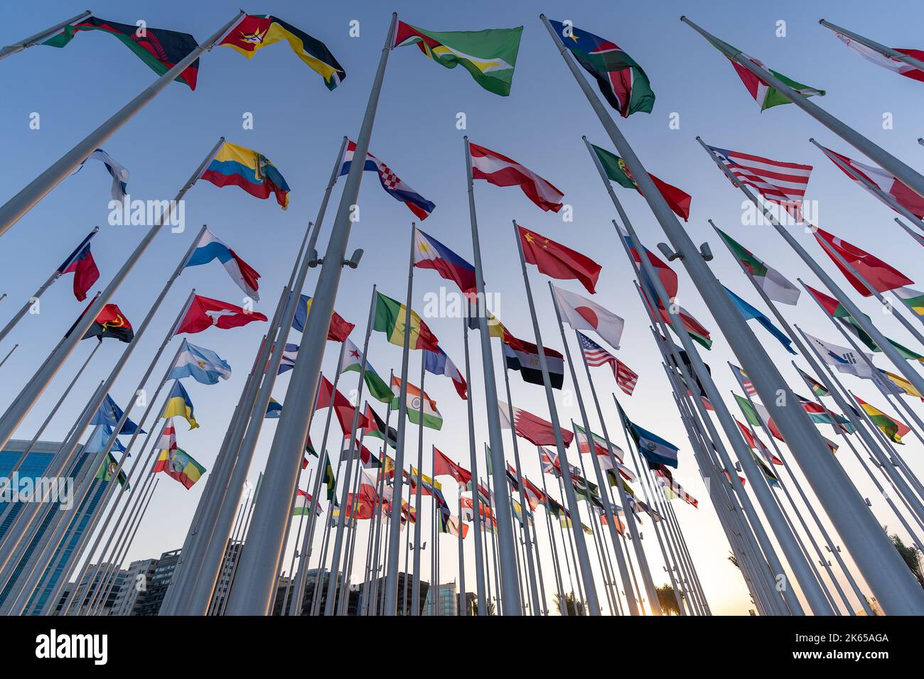 Flags of the different countries against the blue sky Stock Photo - Alamy