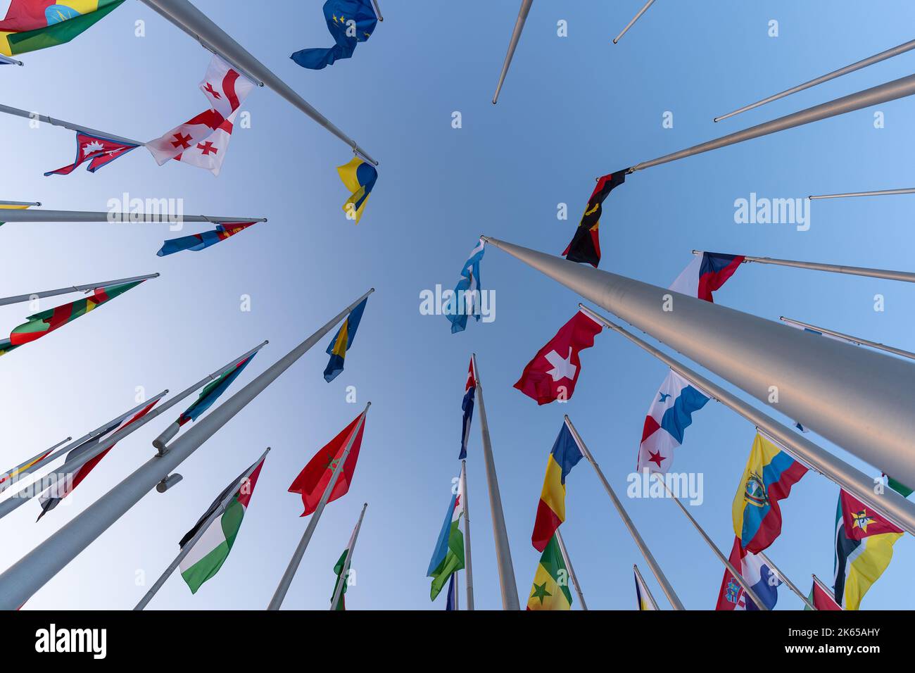 Flags of the different countries against the blue sky Stock Photo - Alamy