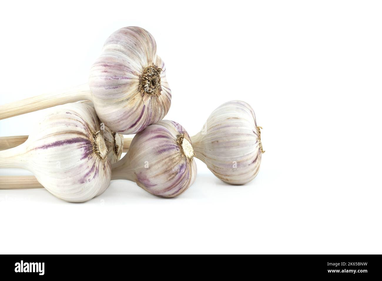 Garlic bulbs in close-up isolated on white background Stock Photo - Alamy